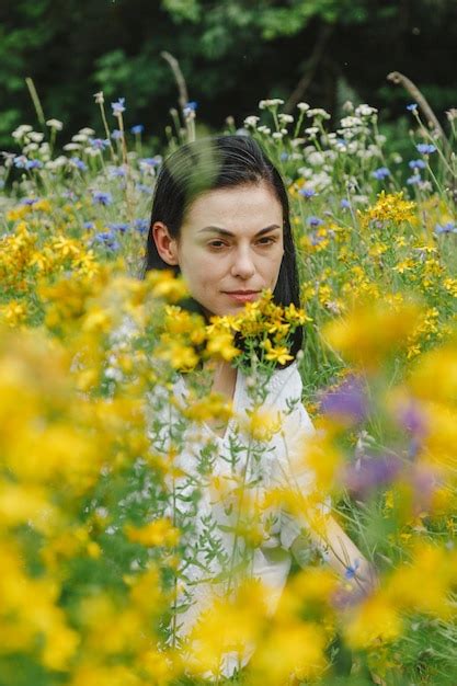 Premium Photo Beautiful Girl Among The Summer Field With Wildflowers