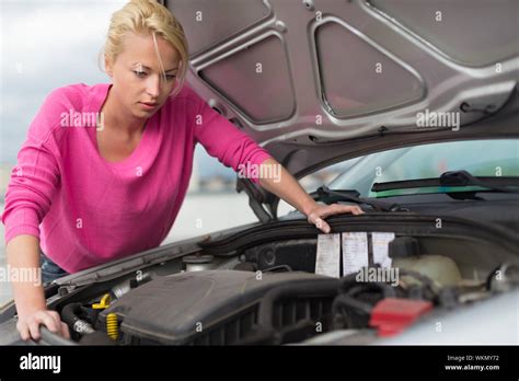 Woman Inspecting Broken Car Engine Stock Photo Alamy