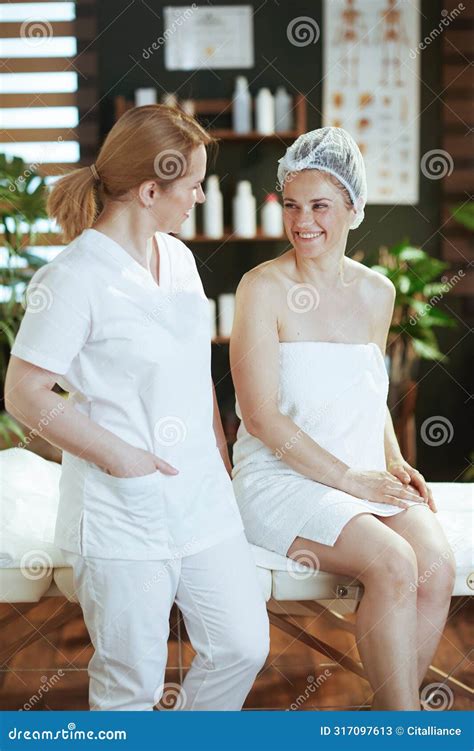 Medical Massage Therapist In Spa Salon With Happy Client Stock Image