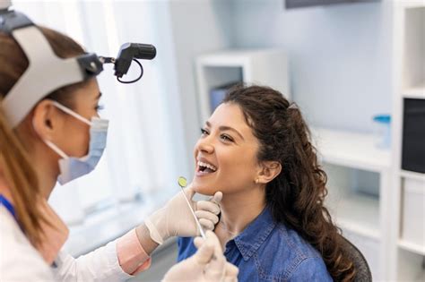 Premium Photo Female Patient Opening Her Mouth For The Doctor To Look In Her Throat Female