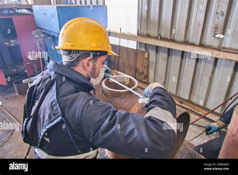 Worker Does Measurement Of Diameter Of A Pipe Man Doing Measurement On A Metal Pipe Stock Photo