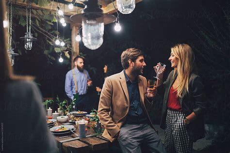 Man And Woman Chatting At The Dinner Party By Stocksy Contributor