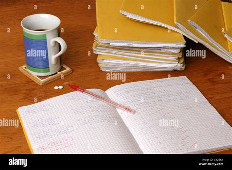 Teacher Marking Books Stock Photo Alamy