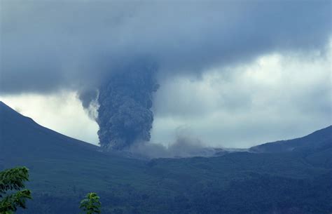 Mount Lokon Volcano Spews A Giant Column Of Volcanic Ash During An