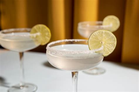 Free Photo Margarita Cocktail In Saucer Glass With Lime On White Table