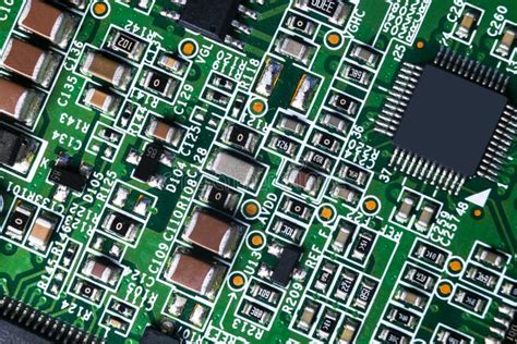 Macro Shot Of A Circuitboard With Resistors Microchips And Electronic Components Computer