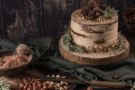 Delicious Naked Chocolate And Hazelnuts Cake On Table Rustic Wood Kitchen Countertop Stock Image