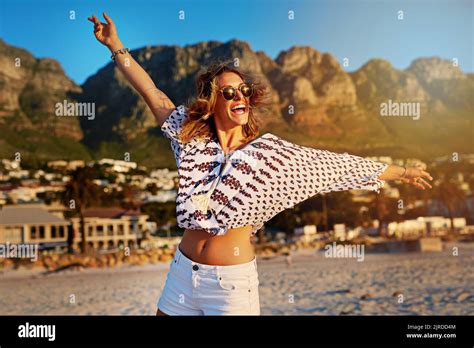 She Feels Most Free At The Beach A Young Woman On The Beach Stock