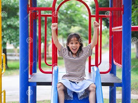 Cute Girl Playing In The Playground During Summer Vacation Happy Girl