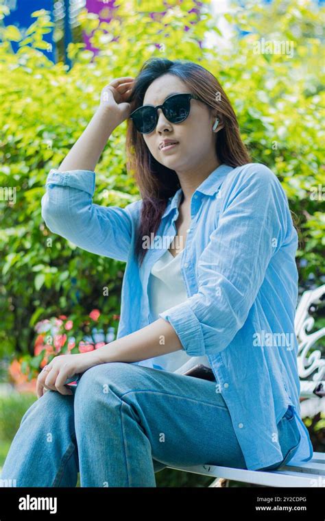 Portrait Of Mature Asian Girl Wearing Glasses Candid Elegant Holding