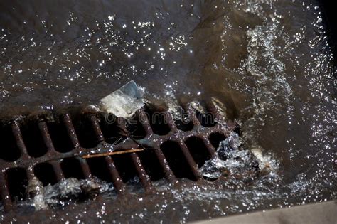 Flow Of Water During Heavy Rain And Clogging Of Street Sewage The Flow