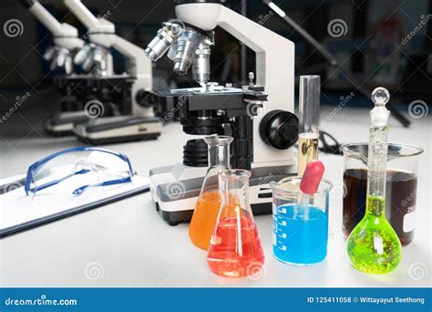 Science Lecture Clipboard With Chemical Experiment In School Laboratory With Beakers Microscope