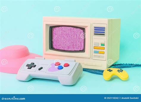 Retro Gaming Console With Pixelated Screen And Colorful Controllers Set Against A Light Blue