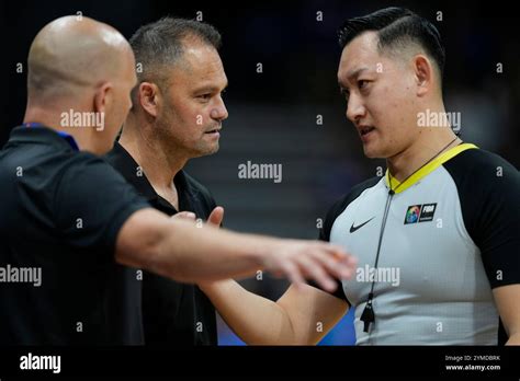New Zealands Coach Judd Flavell Center Talks With The Referee During Their Game Against The