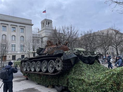 Two Germans Parked A Mangled Russian Tank In Front Of The Russian