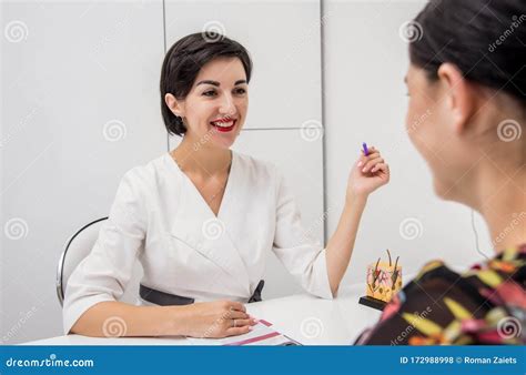 Face Skin Analyze System Cosmetologist Analyzing Woman Face Stock