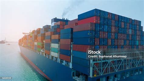 Stern Of Large Cargo Container Ship Import Export Container Box On The Ocean Sea On Blue Sky