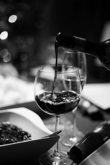 Premium Photo Close Up Of Wineglass On Table