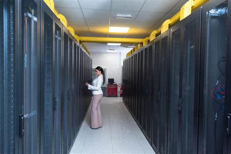 Female Engineer Working On A Tablet Computer In Server Room 11922523