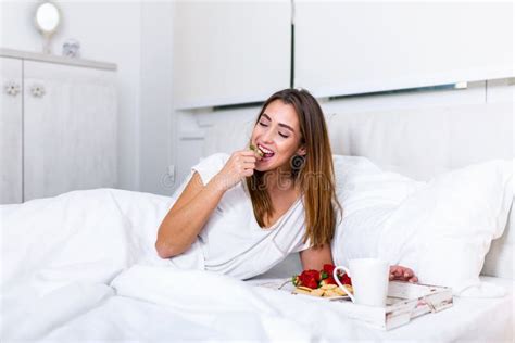 Happy Attractive Woman Woke Up In The Morning In Bed Good Morning And