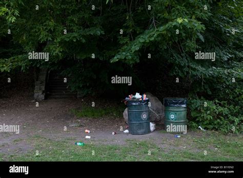 Overflowing Trash Bins In A Park Stock Photo Alamy