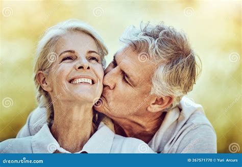 Senior Couple Kiss And Cheek With Smile For Love Romance And Embrace