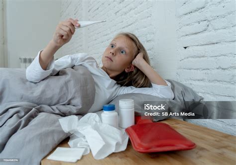 Sweet Sick Cute Girl Feeling Sick Lying In Bed With Medicines