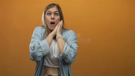 Woman Covers Mouth With Both Hands In A Surprise Gesture And Displays