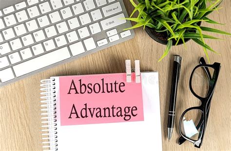 Business Concept Notebook With Text Absolute Advantage On Pink Sticky With Keyboard Glasses