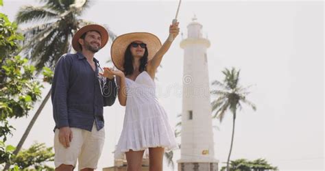 Couple Taking Selfie With Smartphone At Galle Fort Lighthouse In Sri