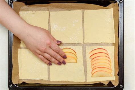 Preparing Apple Pastries By Hand On A Baking Sheet Stock Image Image