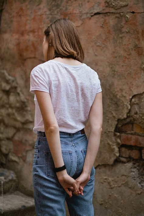 Anonymous Woman Standing With Her Hands Behind Her Back Del