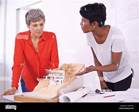 Do You Think We Should Make Any Adjustments Two Female Architects Discussing An Architectural
