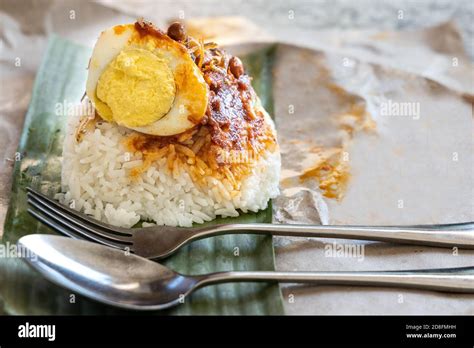 Simple Authentic Nasi Lemak Bungkus Wrapped With Banana Leaf Stock
