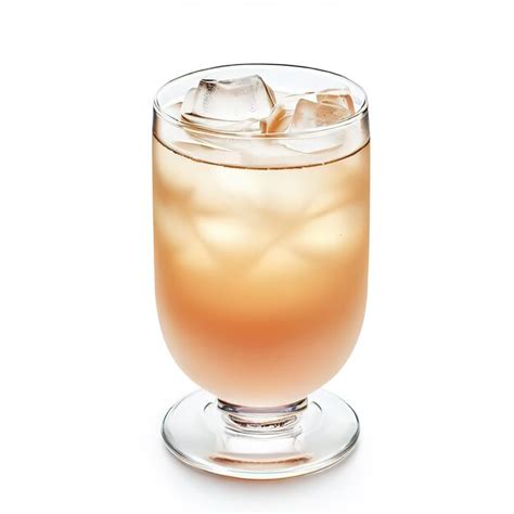 Premium Photo Alcoholic Cocktail In A Glass With Ice Brown Color