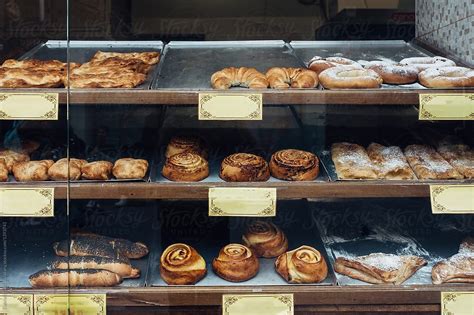 View Various Pastries In A Bakery Display Window By Stocksy