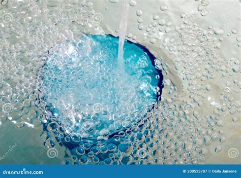 Overflowing Water In A Blue Glass Stock Image Image Of Overflow