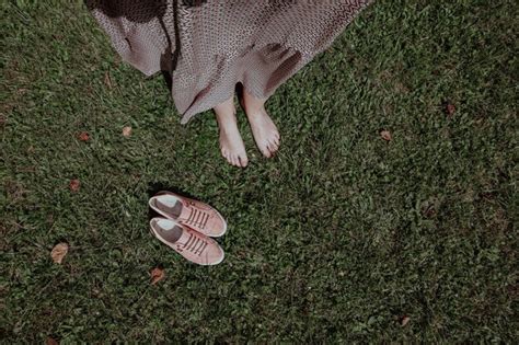 Premium Photo Low Section Of Person Standing On Grass