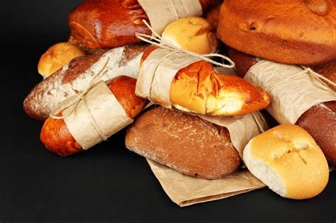 Premium Photo Different Types Of Bread On Black Background Closeup