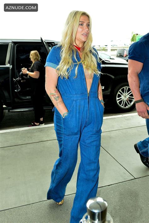 Kesha Wears A Lowcut Denim Jumpsuit While Skipping Town Through Lax Airport Aznude