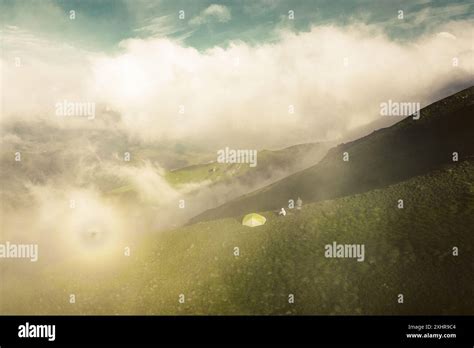 Aerial Scenic Morning View Couple Stand Camping Enjoy Sunshine By Tent