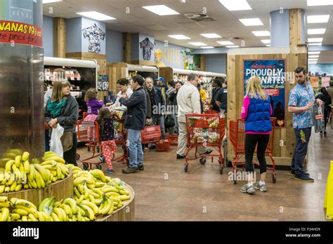 interior Trader Joe's upper West side as man in flowered shirt holds ...