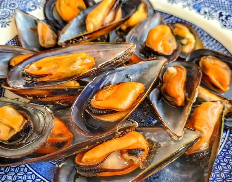 Delicious Stuffed Peppers With Orange Sauce Fresh Mussels On A Plate