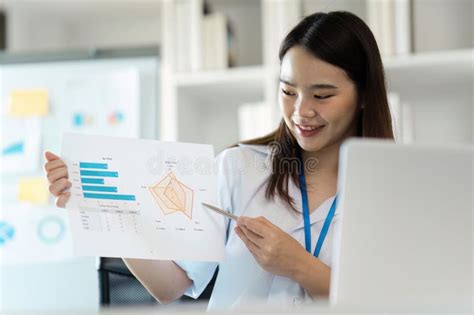 Businesswoman Analyzing Data Charts In Office Presenting Financial Report With Graphs And