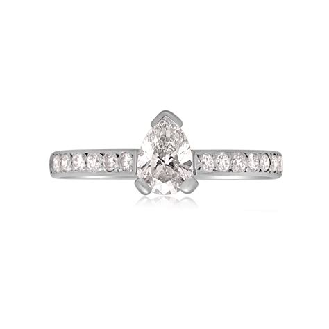 Platinum Pear Shaped Diamond Single Stone Ring With Diamond Shoulders