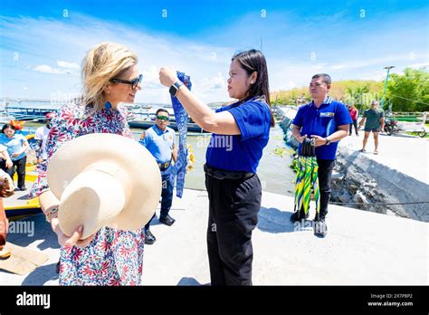 Talim Island Queen Maxima Visits Card Mri And Pioneer Insurance On