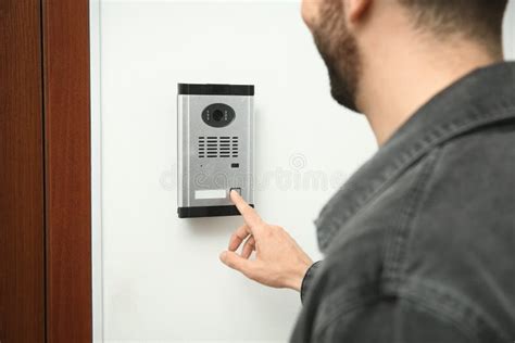 Man Ringing Intercom With Camera In Entryway Closeup Stock Photo Image Of Home Automation