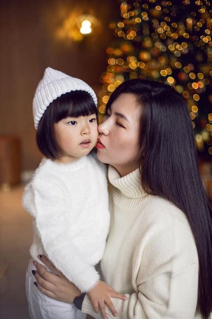 Premium Photo Beautiful Korean Mom And Baby Daughter Sitting In White