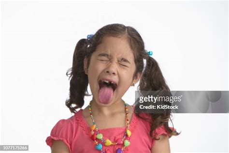 Long Tongue Girls Photos And Premium High Res Pictures Getty Images