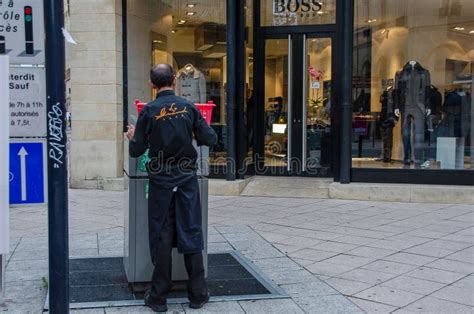 Man Throwing Garbage In The Bin In Bordeaux France In September Editorial Stock Photo